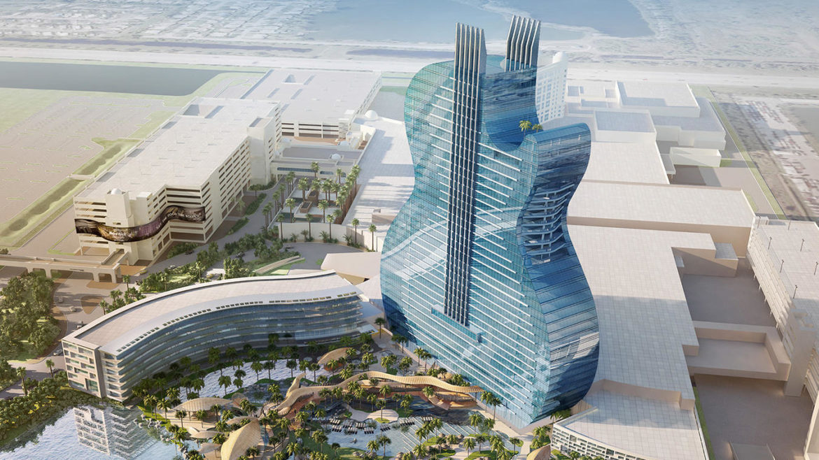Musicians Smash Guitars Celebrating Giant Guitar Tower of Hard Rock ...